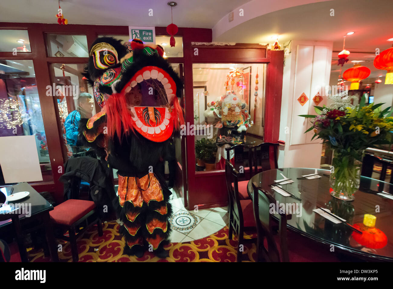 Lion Dancer from the London Chinatown Chinese Association entering the ...