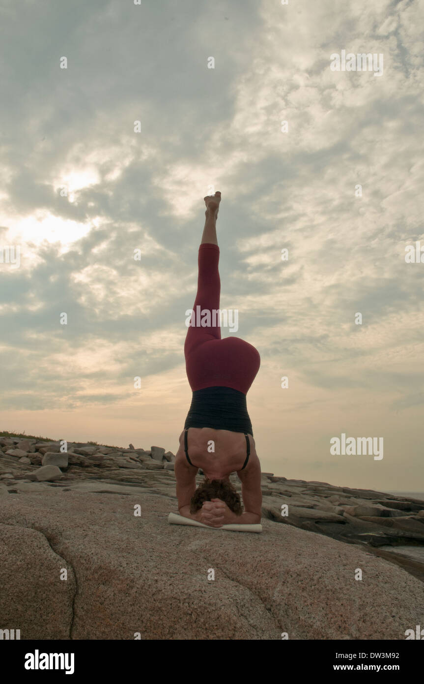 Iyengar Yoga Instructor Demonstrates Sirsasana Eka pada from back ...