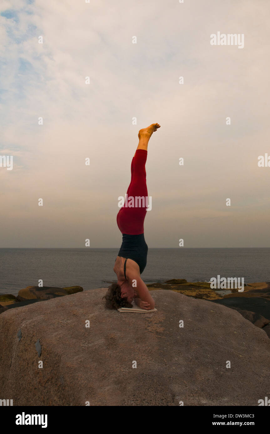 Iyengar yoga instructor demonstrates sirsasana hi-res stock photography ...