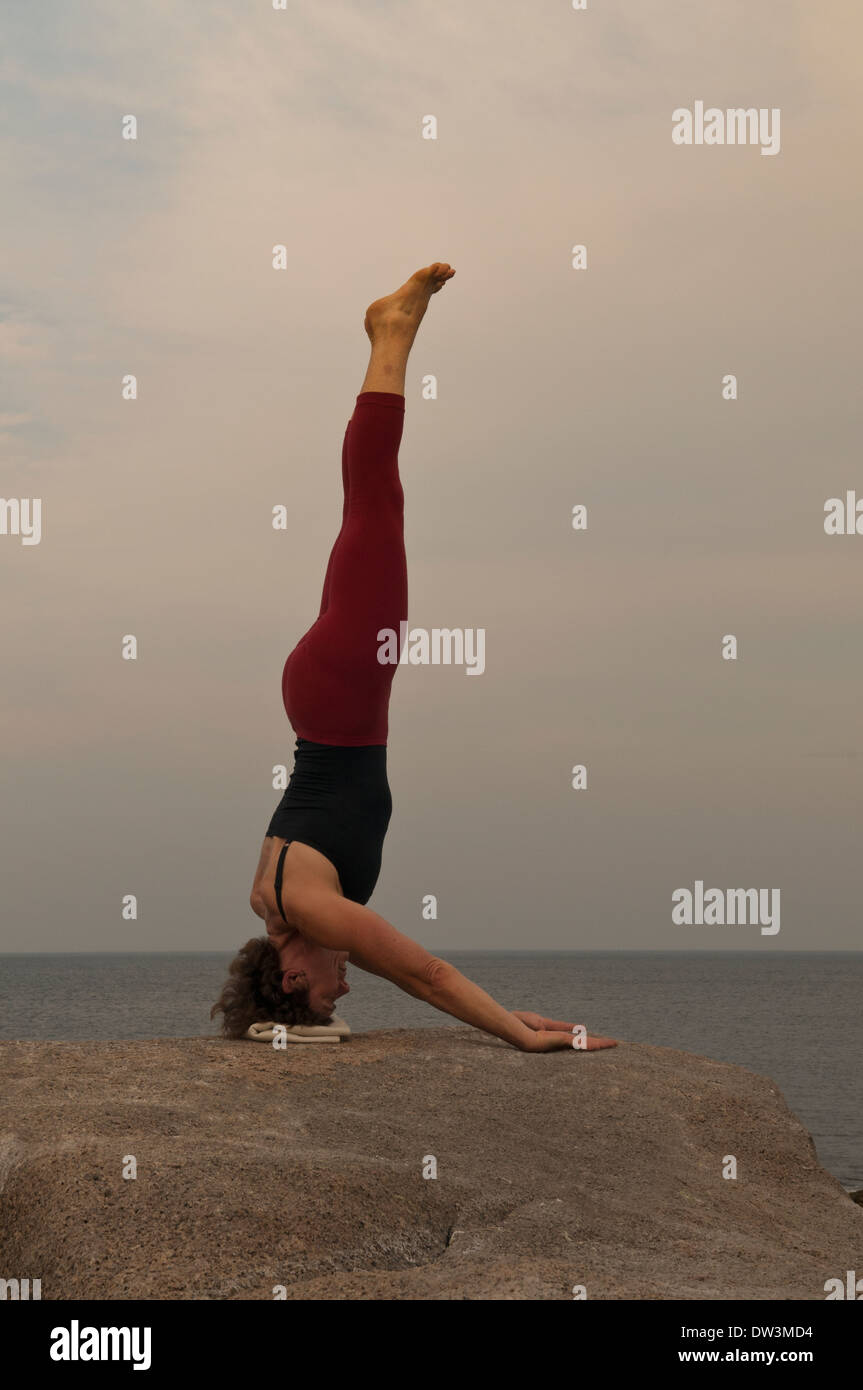 Iyengar Yoga Instructor Demonstrates Sirsasana Mukta Hasta (Inverted ...