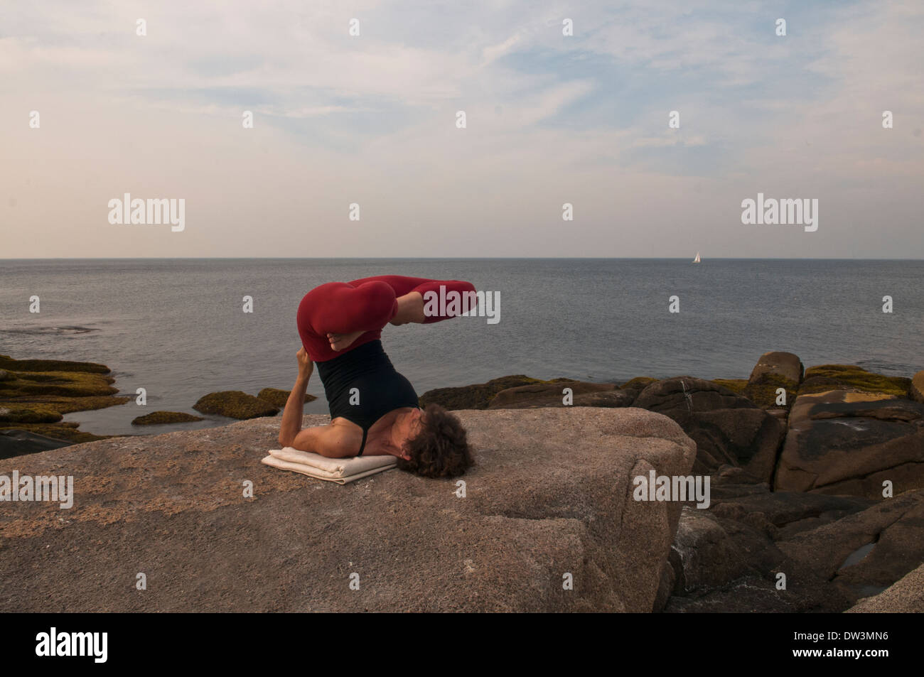 Iyengar Yoga Instructor Demonstrates Sarvangasana Padmasana (inverted ...