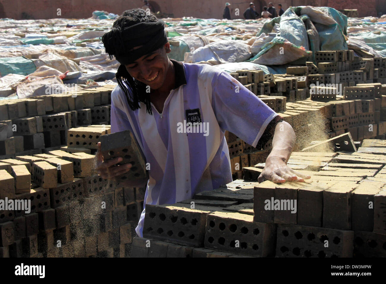 Helwan, Cairo, Egypt. 19th Feb, 2014. An Egyptian laborer works at a ...