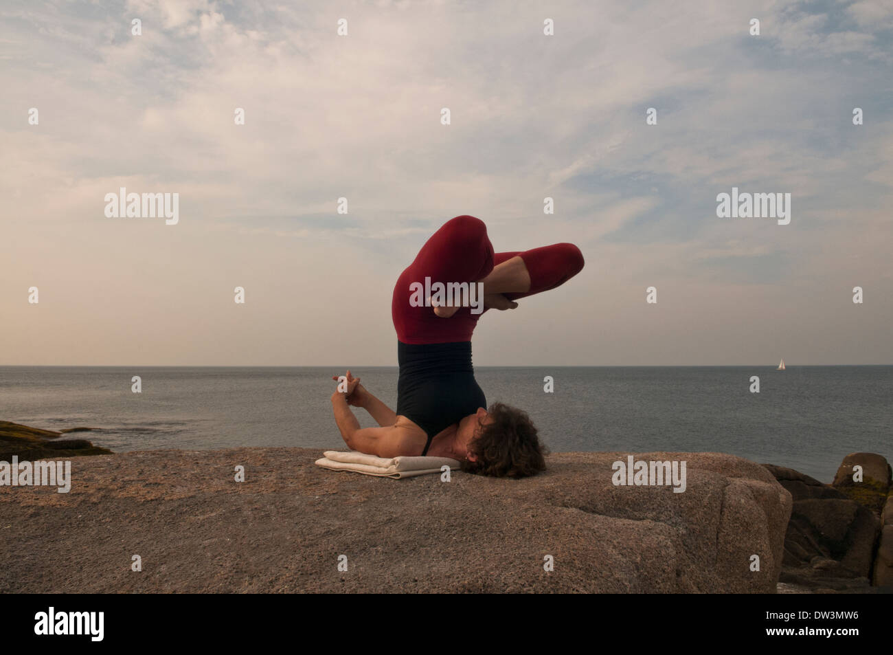 Iyengar Yoga Instructor Demonstrates Sarvangasana Padmasana (inverted ...
