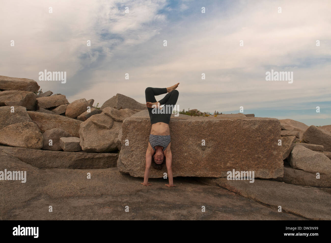 Iyengar Yoga Instructor Demonstrates Adho Mukha Vriksasana Padmasana ...