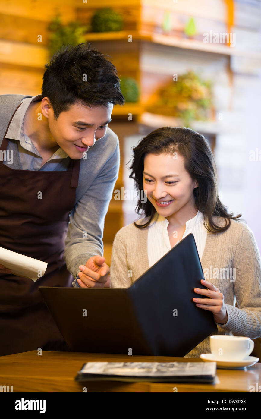 Waiter explaining menu hi-res stock photography and images - Alamy