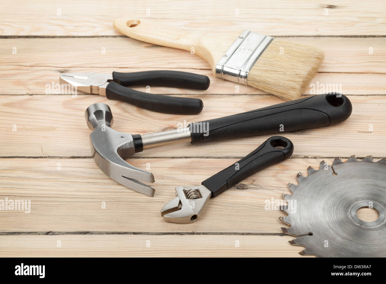 Set of tools on wood panel background Stock Photo - Alamy