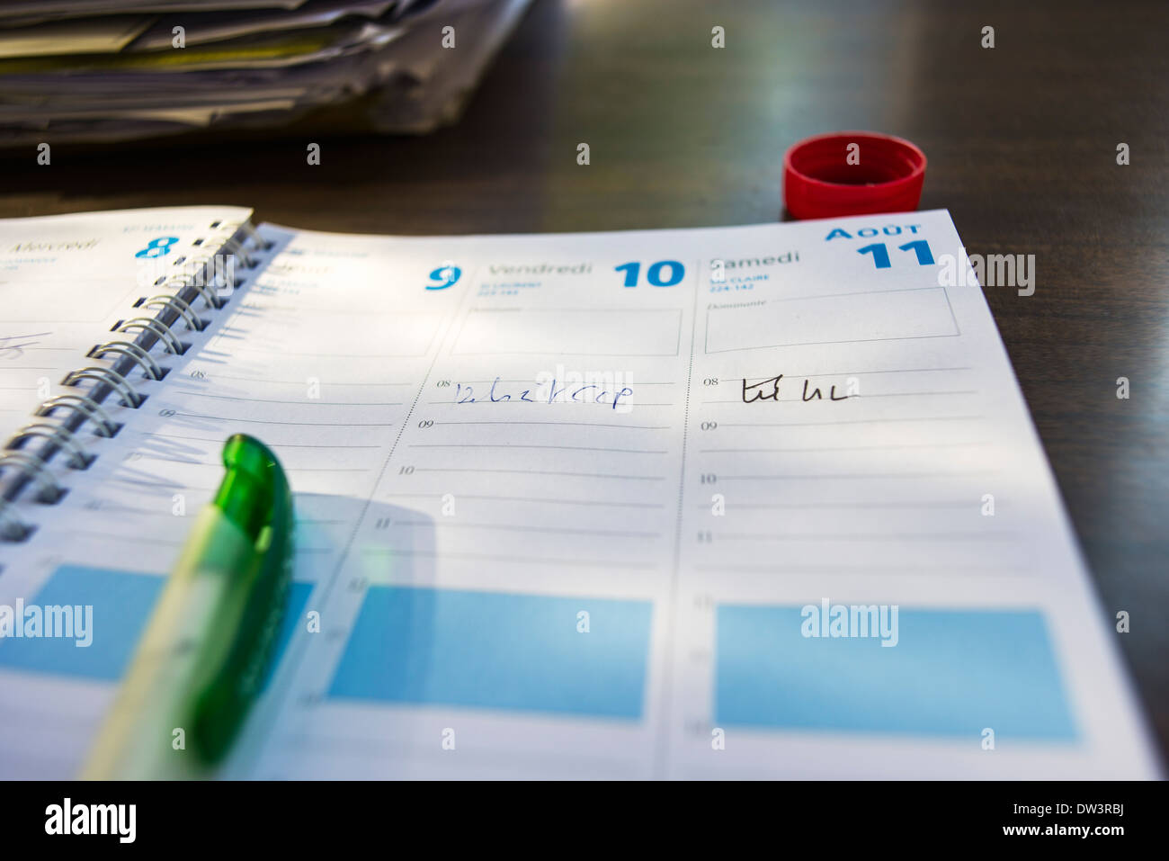 Desk diary with a pen Stock Photo - Alamy