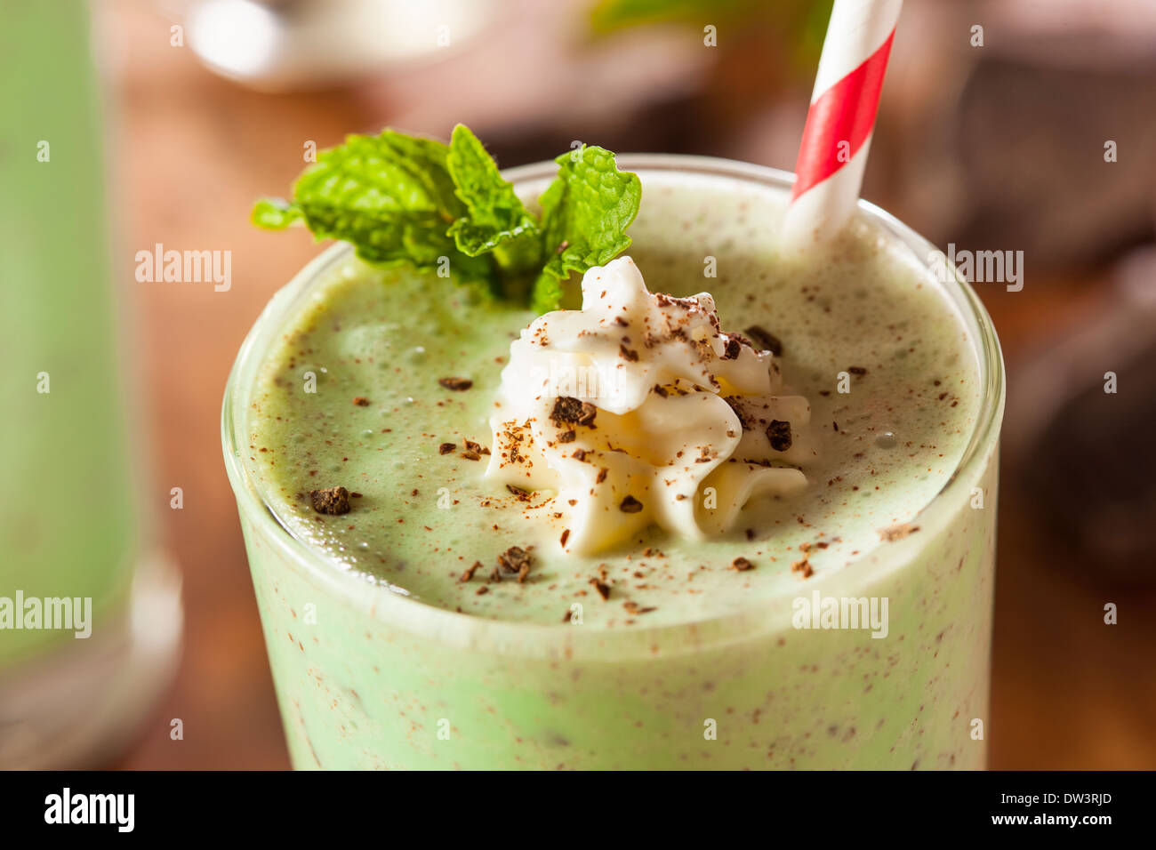 Cold Refreshing Mint Chocolate Chip MilkShake with a Straw Stock Photo ...