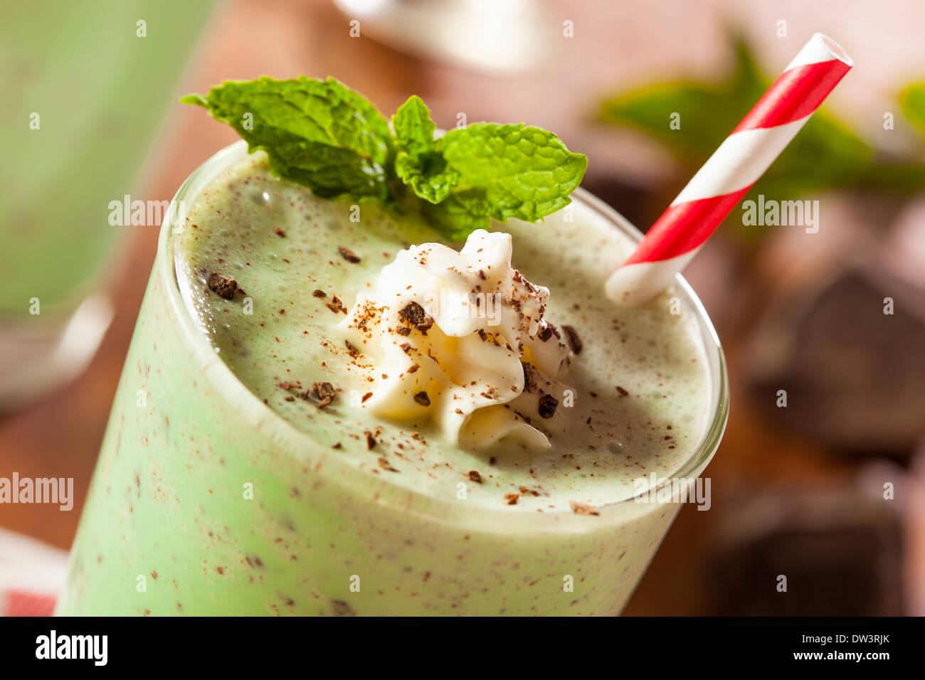 Cold Refreshing Mint Chocolate Chip MilkShake with a Straw Stock Photo ...