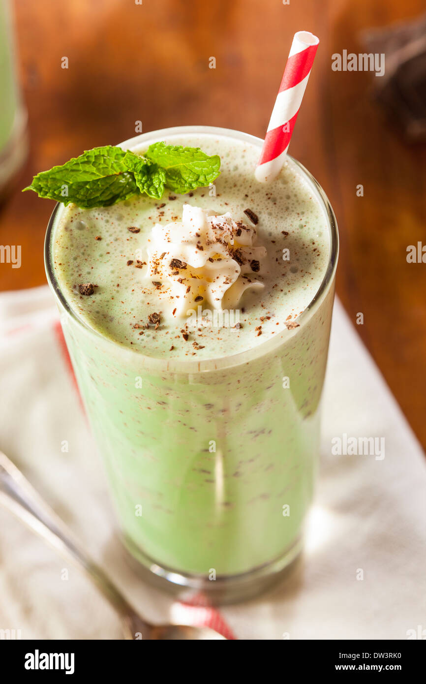 Cold Refreshing Mint Chocolate Chip MilkShake with a Straw Stock Photo ...