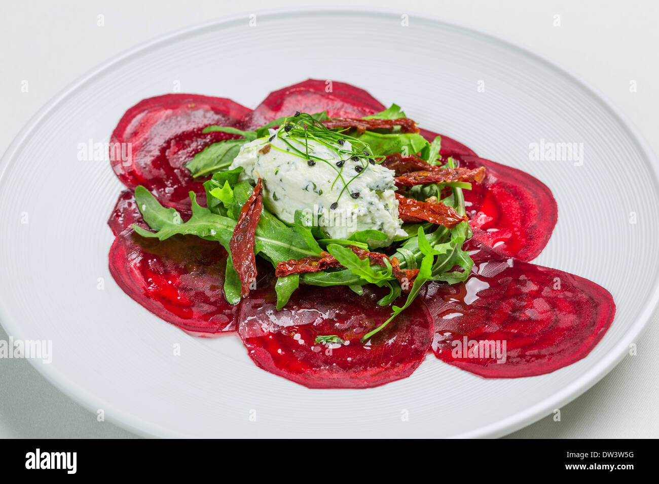 Soft cheese with sliced beetroot, sun dried tomato and rocket leaf ...