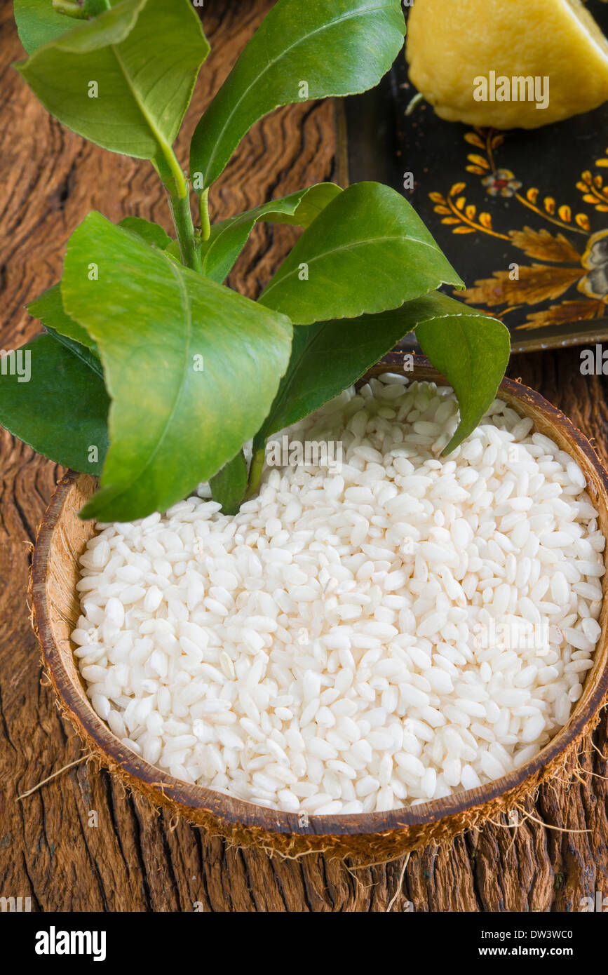 Chinese polished white raw rice in coconut emptied Stock Photo - Alamy