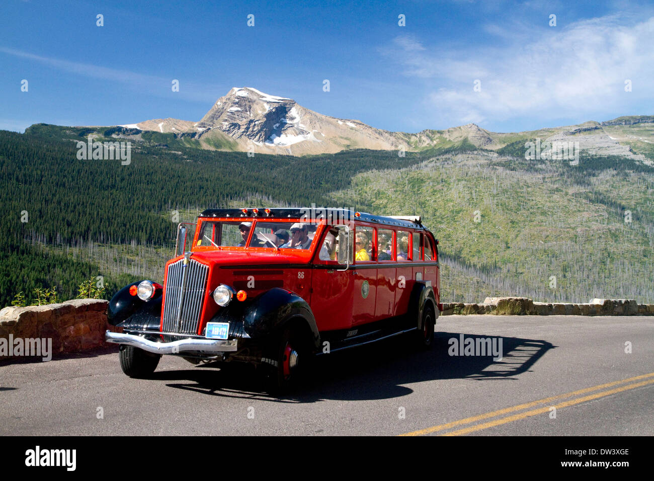 Red Jammer bus on the Going-to-the-Sun Road in Glacier National Park ...