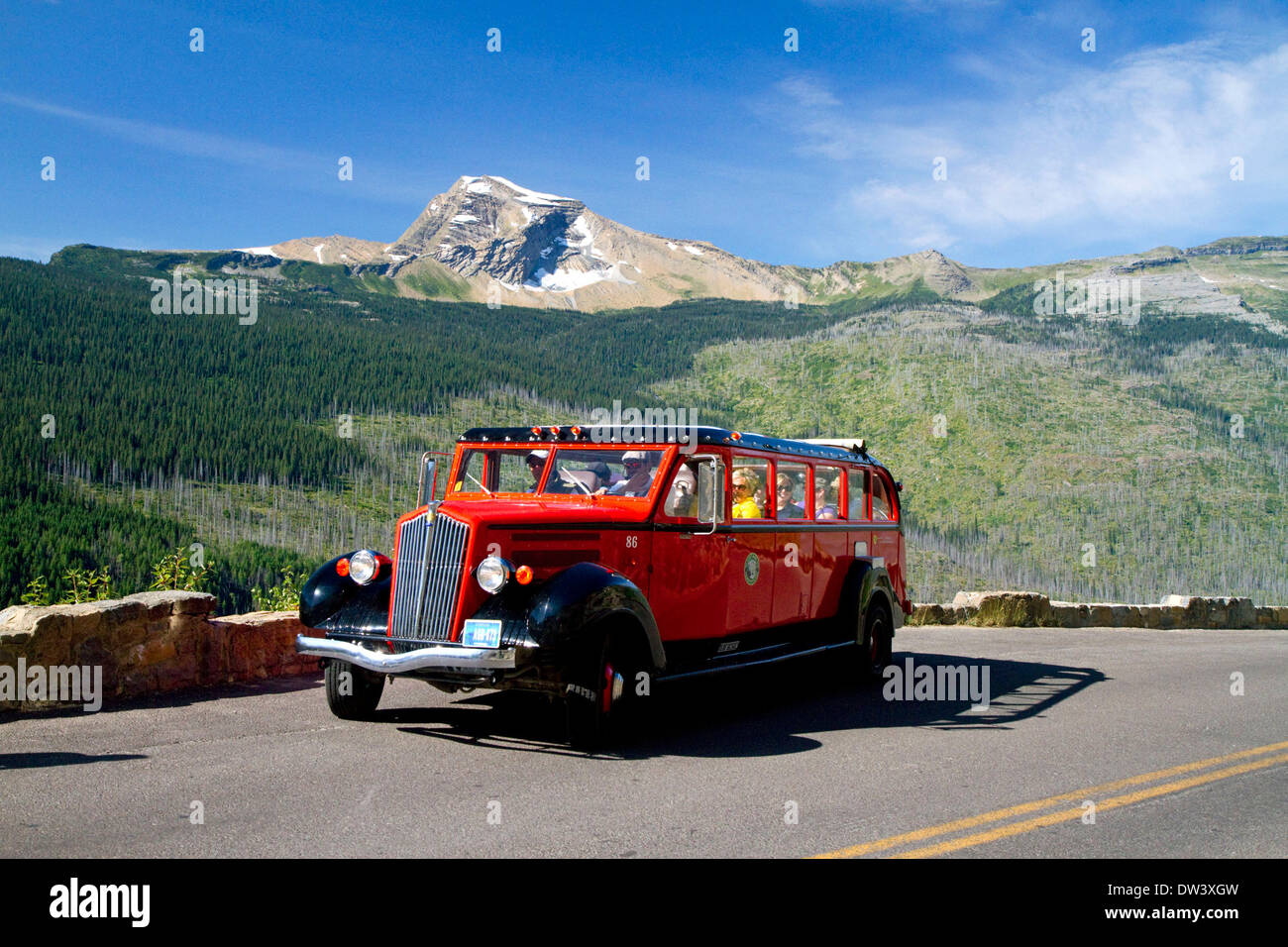 Red Jammer bus on the Going-to-the-Sun Road in Glacier National Park ...