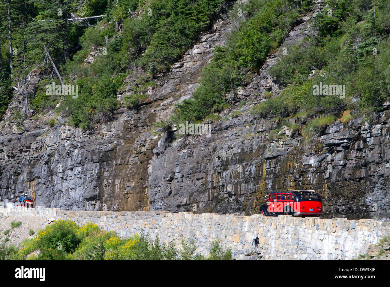 Red Jammer bus on the Going-to-the-Sun Road in Glacier National Park ...