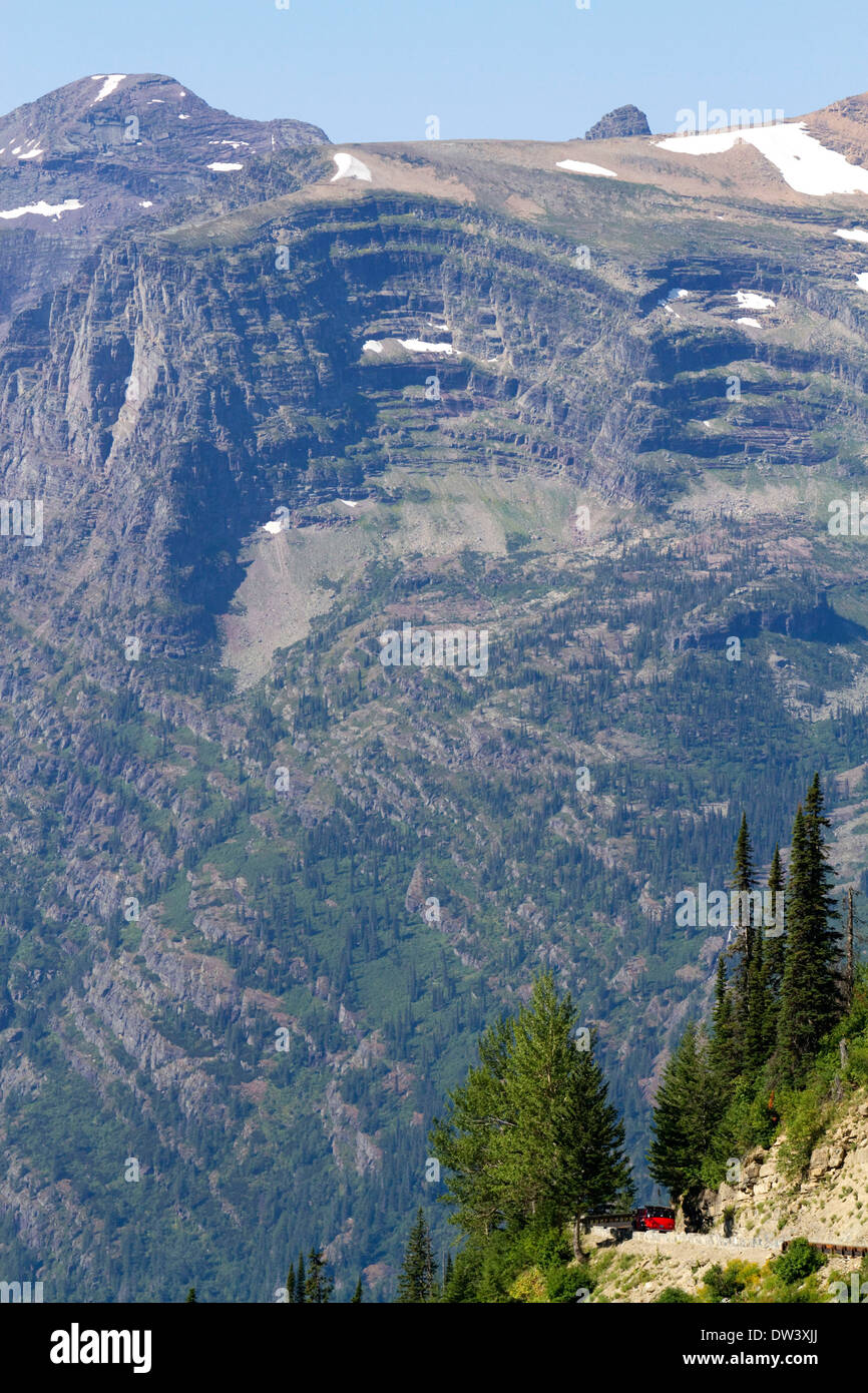 Red Jammer bus on the Going-to-the-Sun Road in Glacier National Park ...