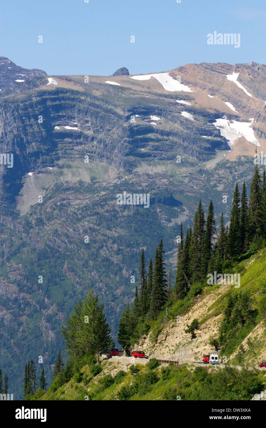 Red Jammer bus on the Going-to-the-Sun Road in Glacier National Park ...