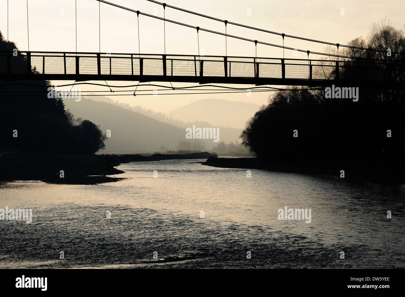 Bridge on a small river at sundown Stock Photo - Alamy