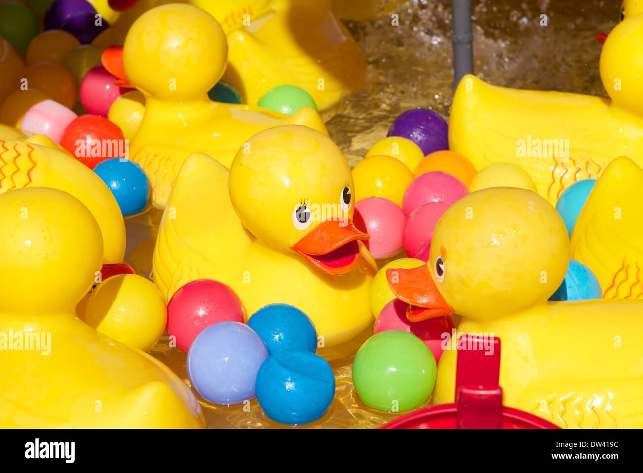 Plastic yellow ducks at a fun fair amusement stall Stock Photo - Alamy