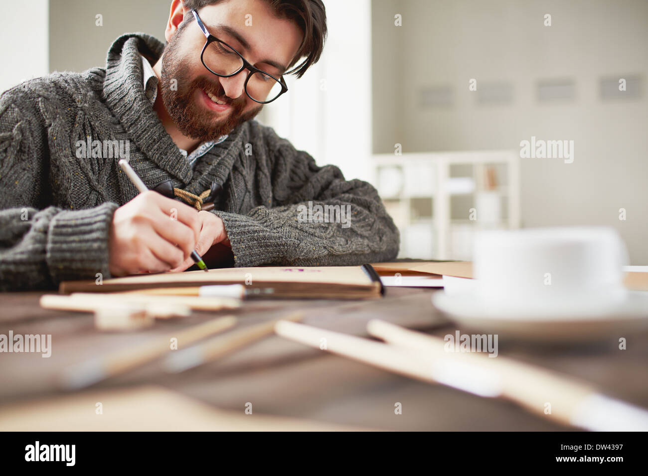 Image of happy young man drawing Stock Photo - Alamy