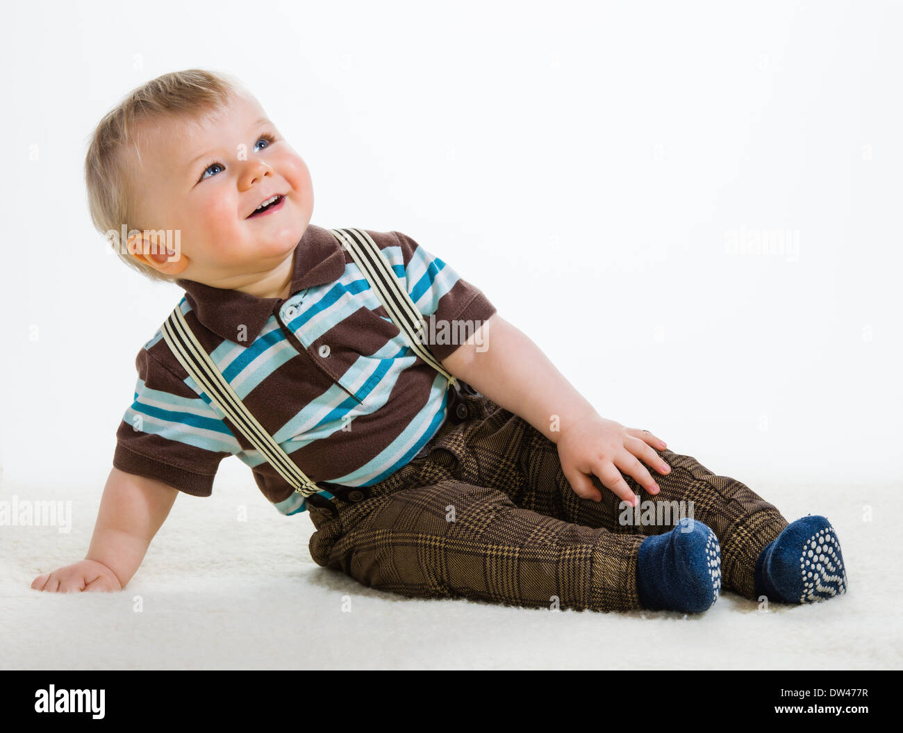 Baby boy, 16 Months old wearing striped shirt and suspenders, white ...