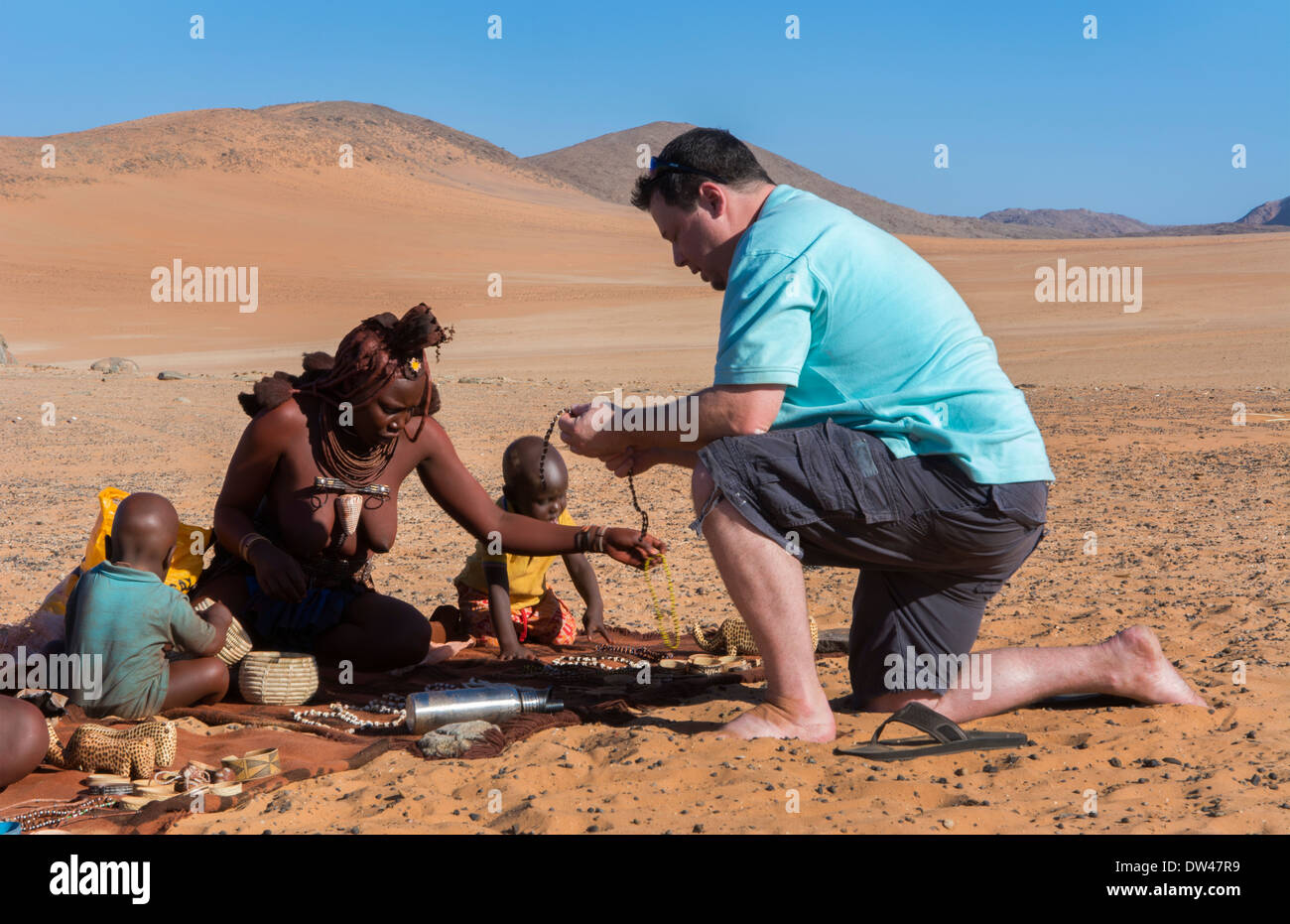 Namibia Africa remote nomadic Himba tribe young woman with child ...