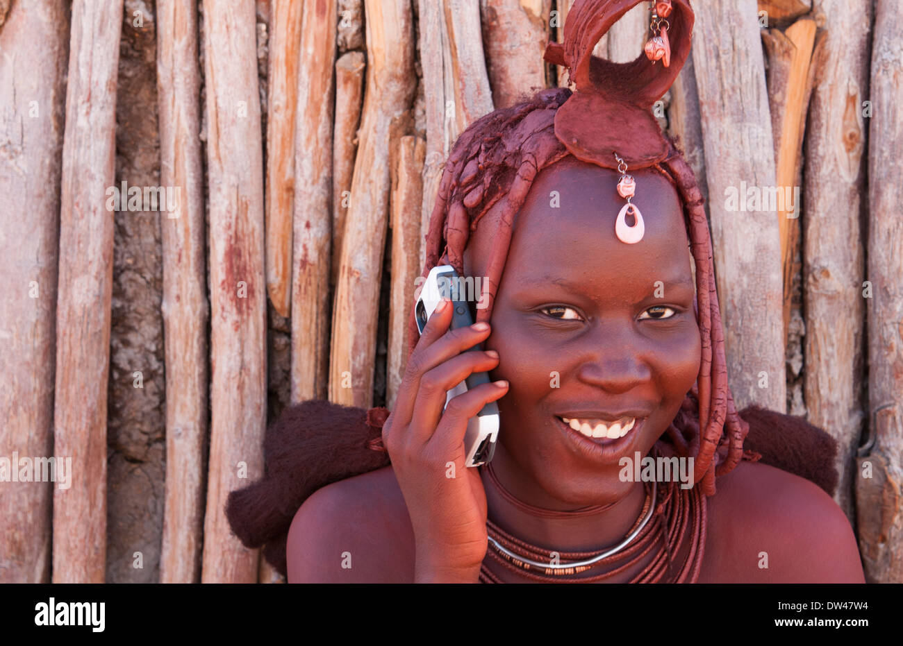 Namibia Africa remote nomadic Himba tribe young women with braids on ...