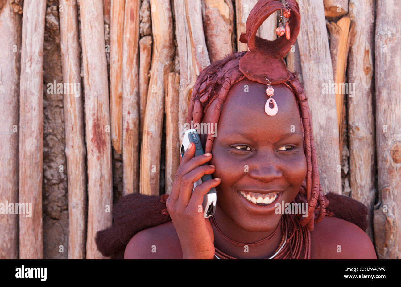 Namibia Africa remote nomadic Himba tribe young women with braids on ...