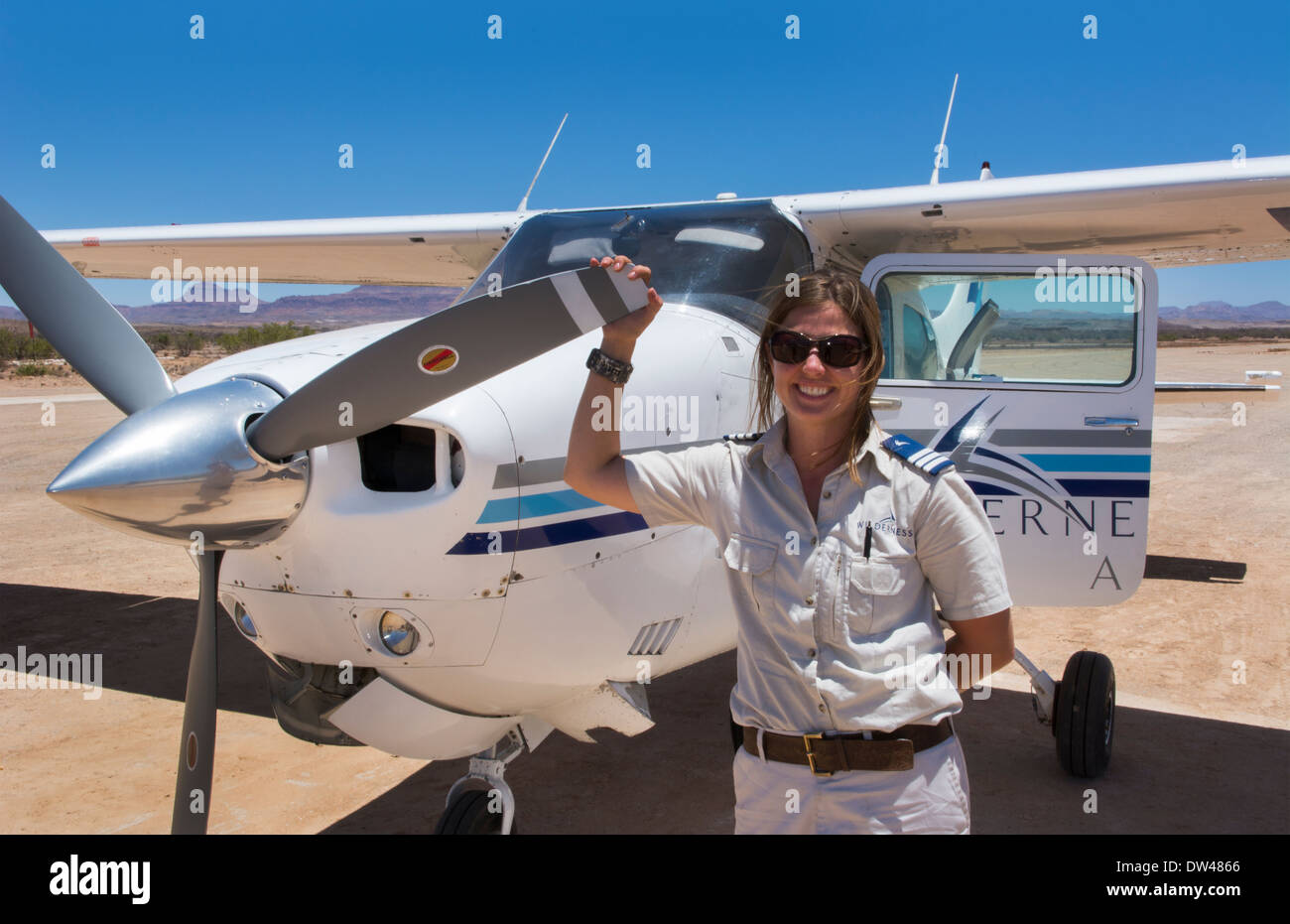 Namibia Namib Desert woman pilot portrait while refueling plane in the ...