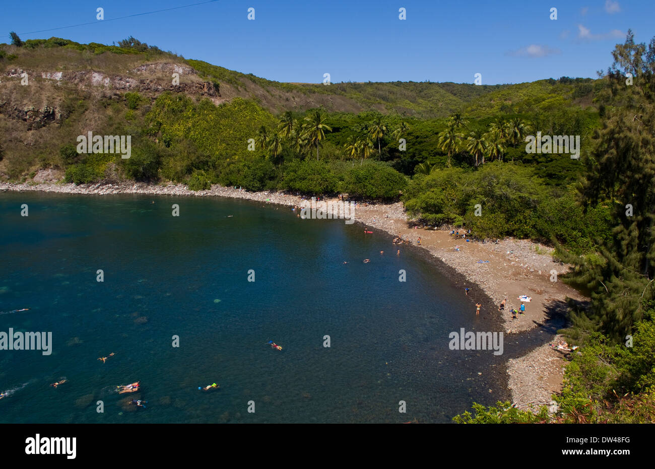 Aerial view of relaxing bay with two catamarans and snorklers swimming ...