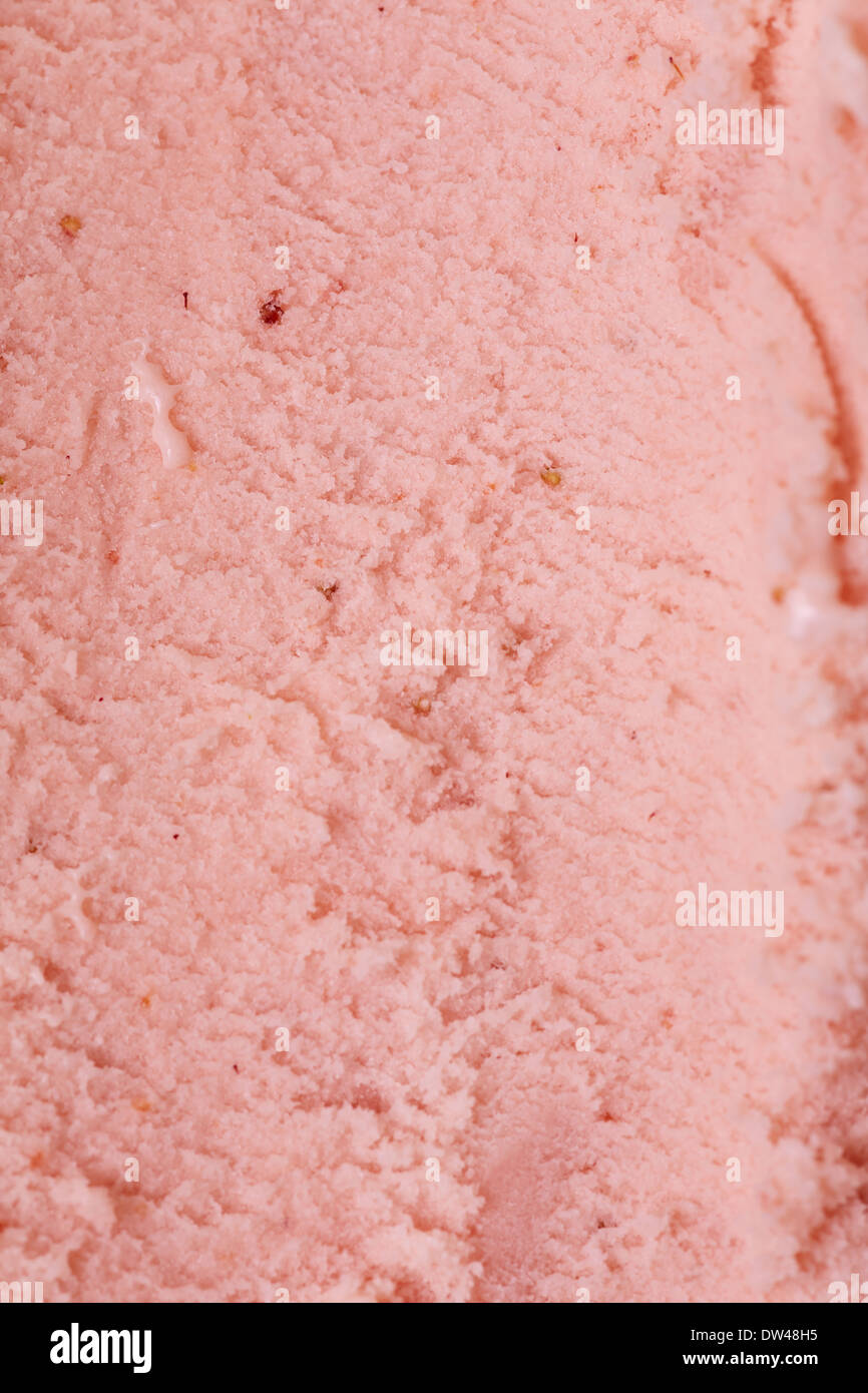 Fresh homemade strawberry ice cream in serving container from above ...