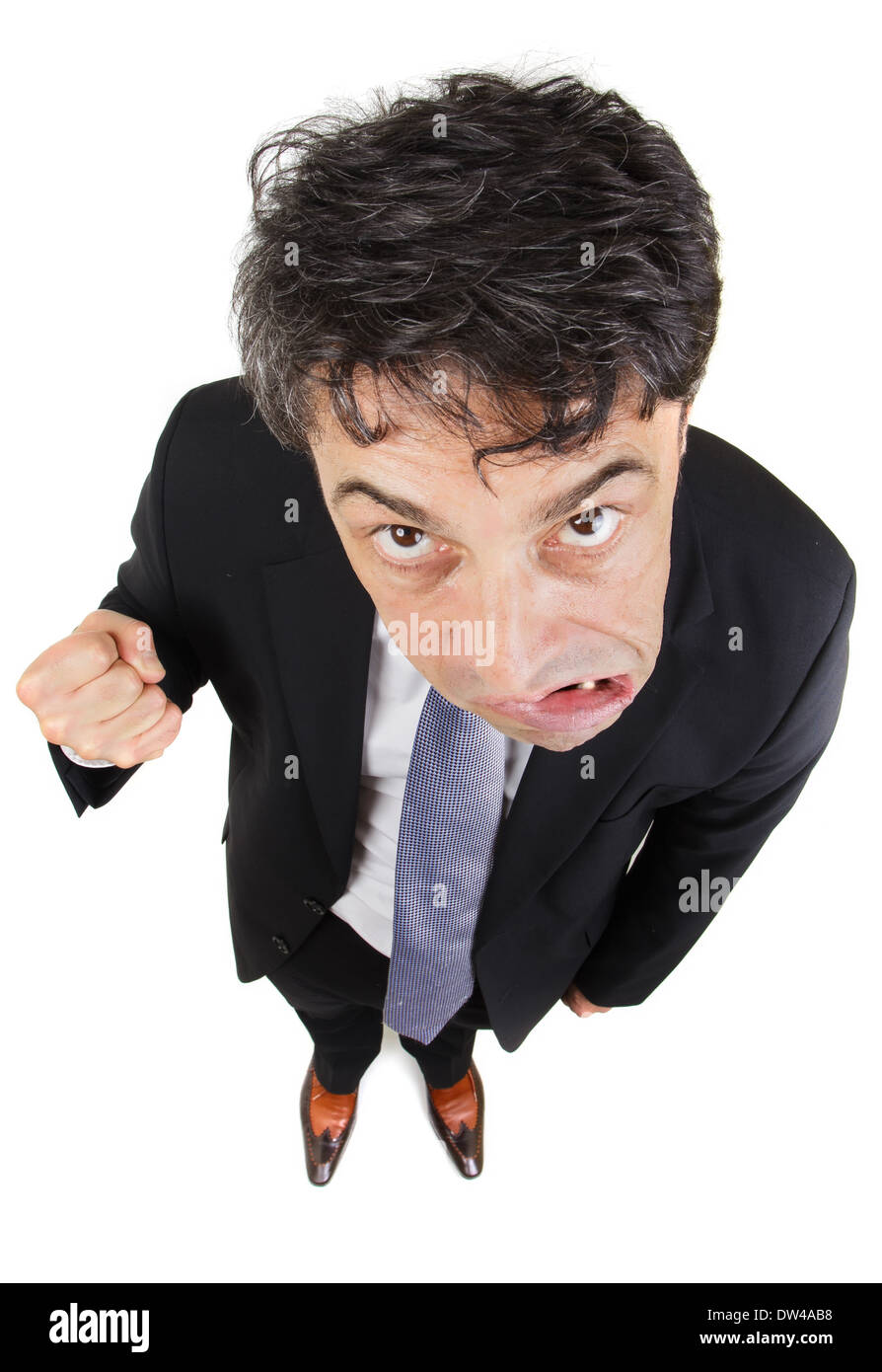 Humorous high angle full length portrait of an angry businessman ...