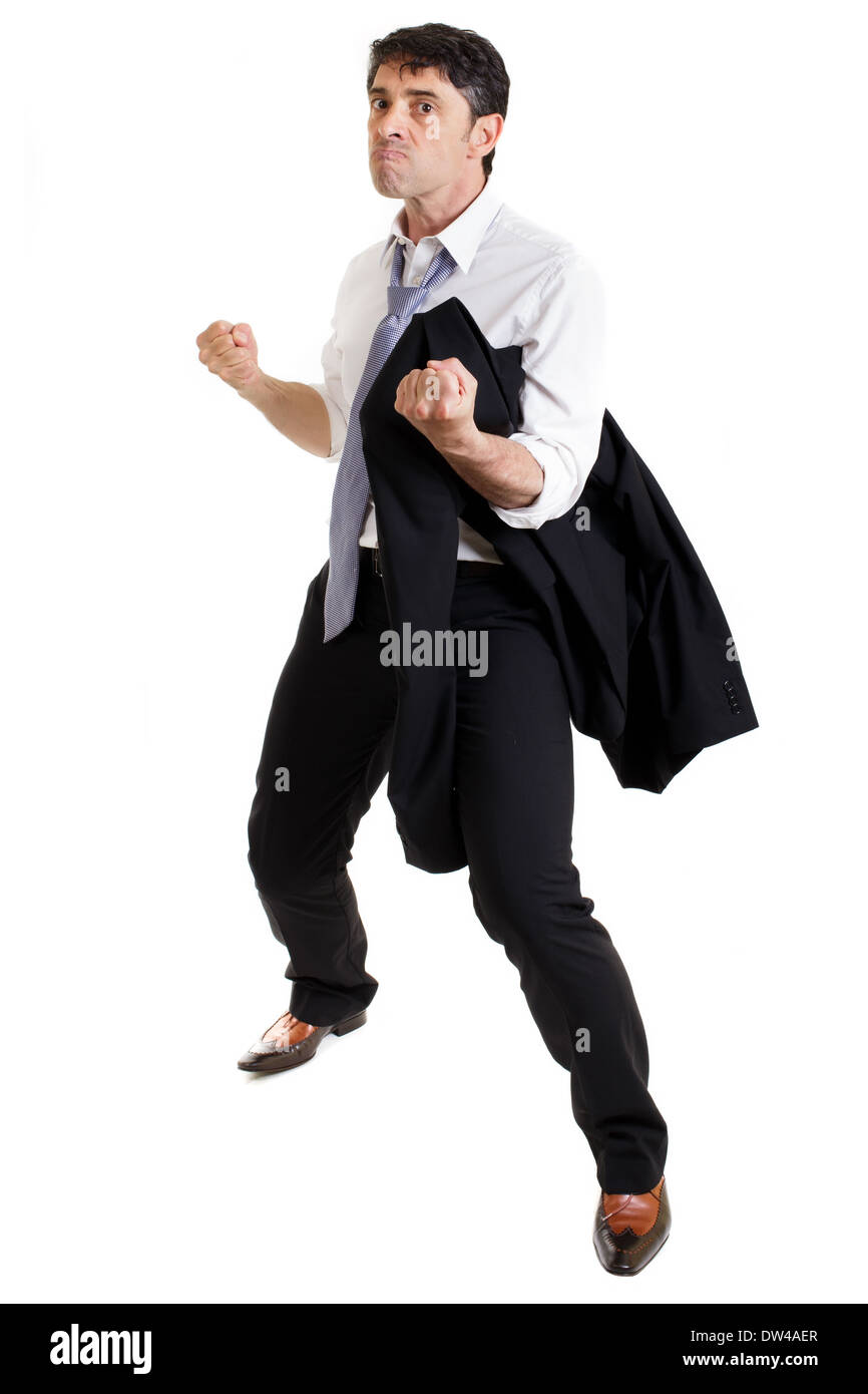Belligerent angry man picking a fight standing with his jacket over his ...