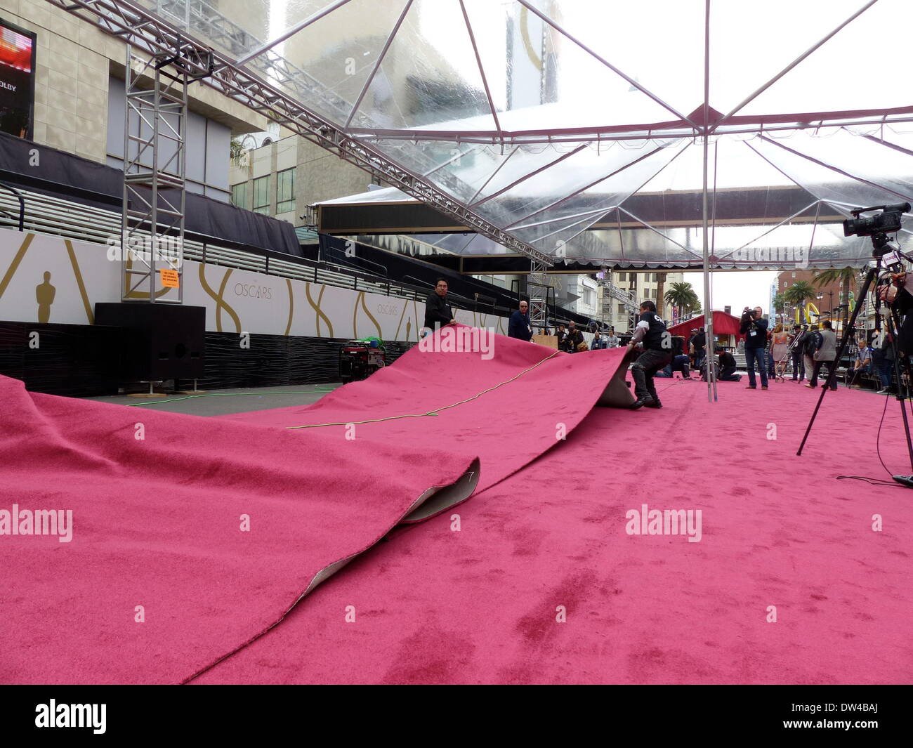Employees from "American Turf & Carpet" install the red carpet for the ...