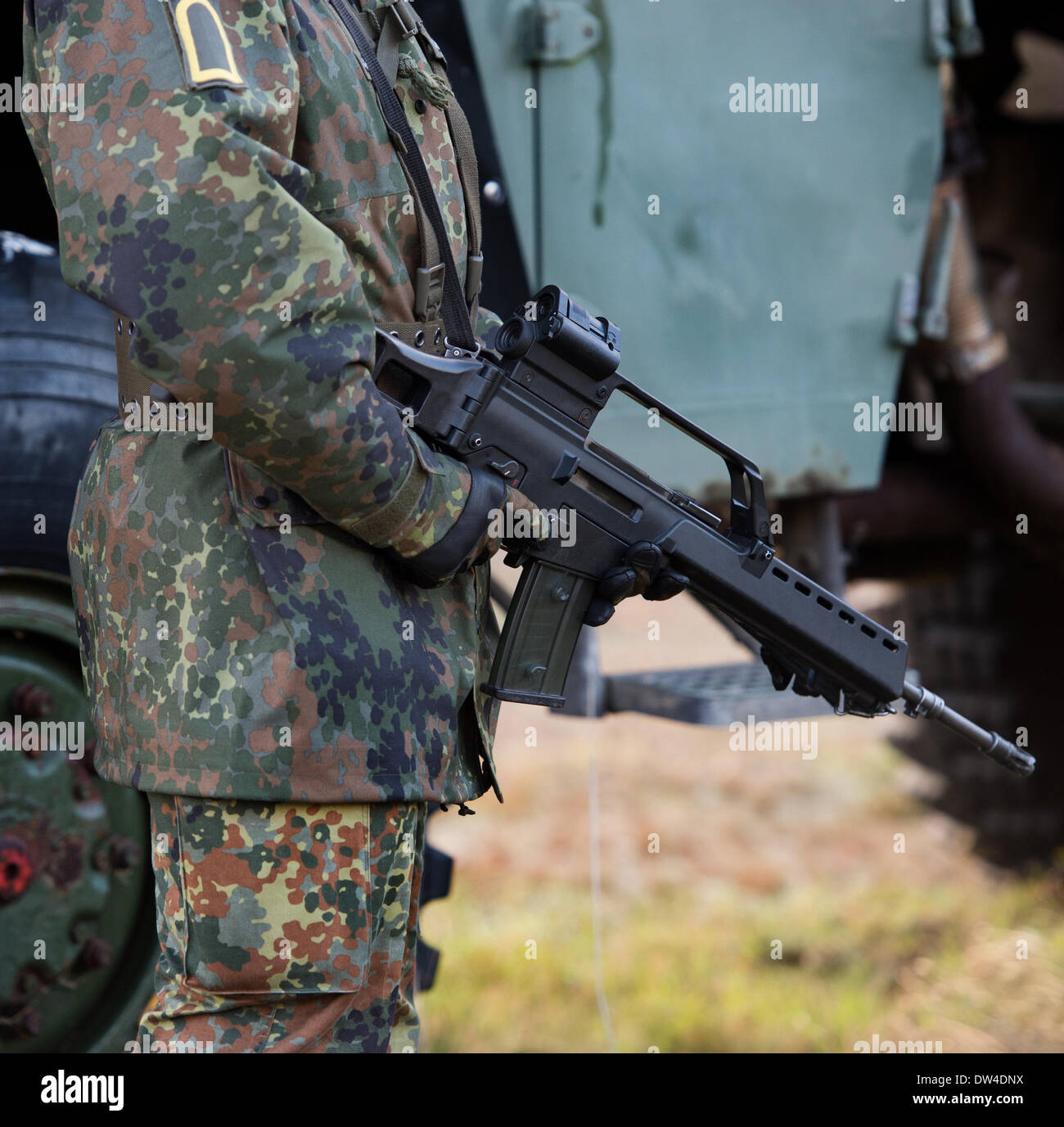Nochten, Germany. 01st Feb, 2014. A soldier holds a Heckler & Koch G36 ...