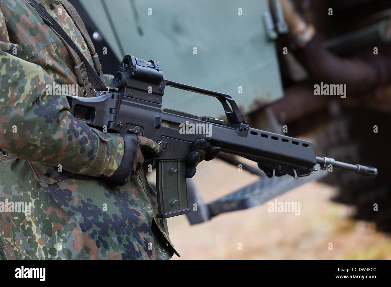 Weisskeissel, Germany. 13th Feb, 2013. A soldier holds a Heckler & Koch ...