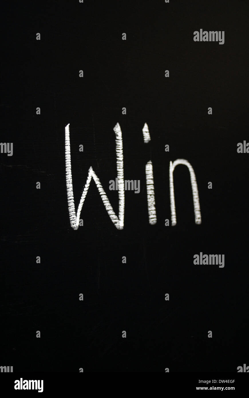 The word win wrote on a chalkboard Stock Photo - Alamy