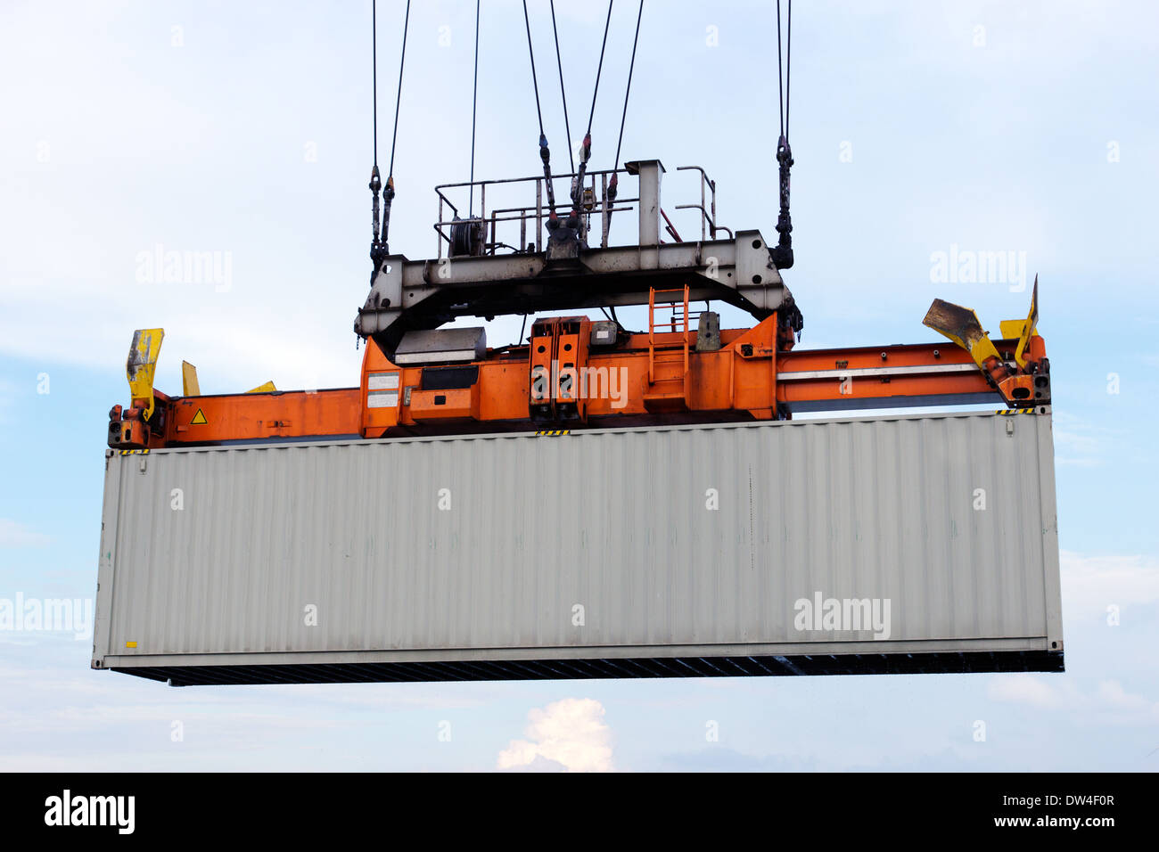 Sea container lifted by a harbor crane Stock Photo - Alamy