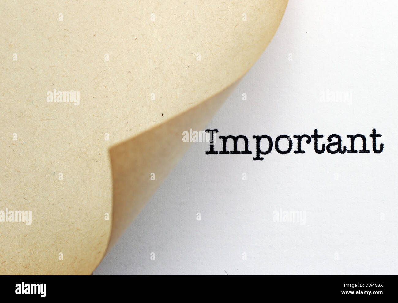 Important text behind paper Stock Photo - Alamy