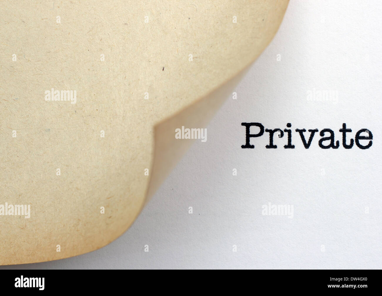 Private text behind paper Stock Photo - Alamy