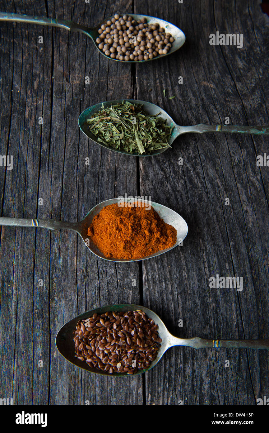 Spices in metal spoons Stock Photo - Alamy