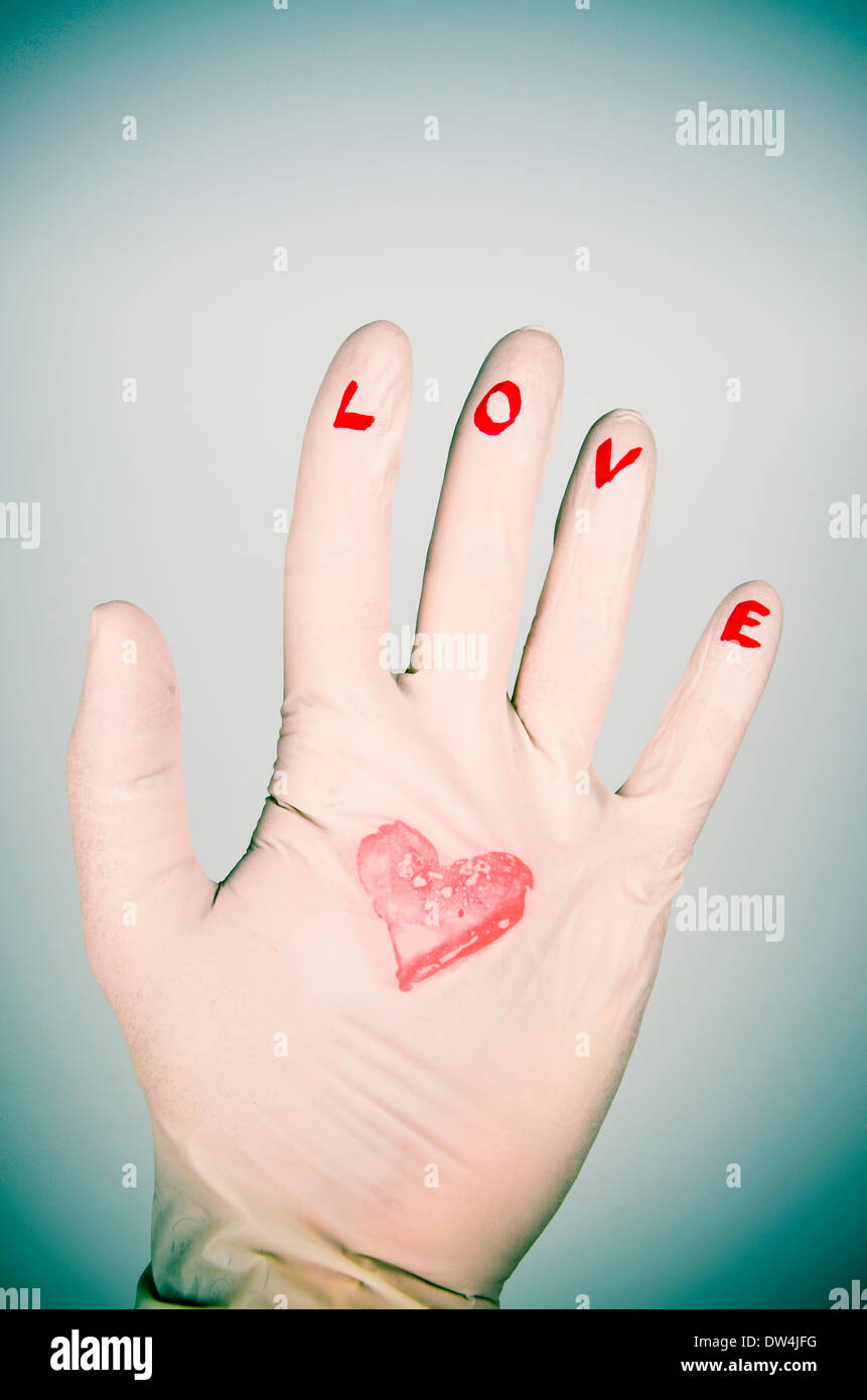 Red heart on a hand Stock Photo - Alamy