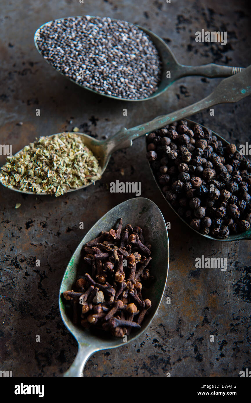 Spices in old metal spoons Stock Photo - Alamy