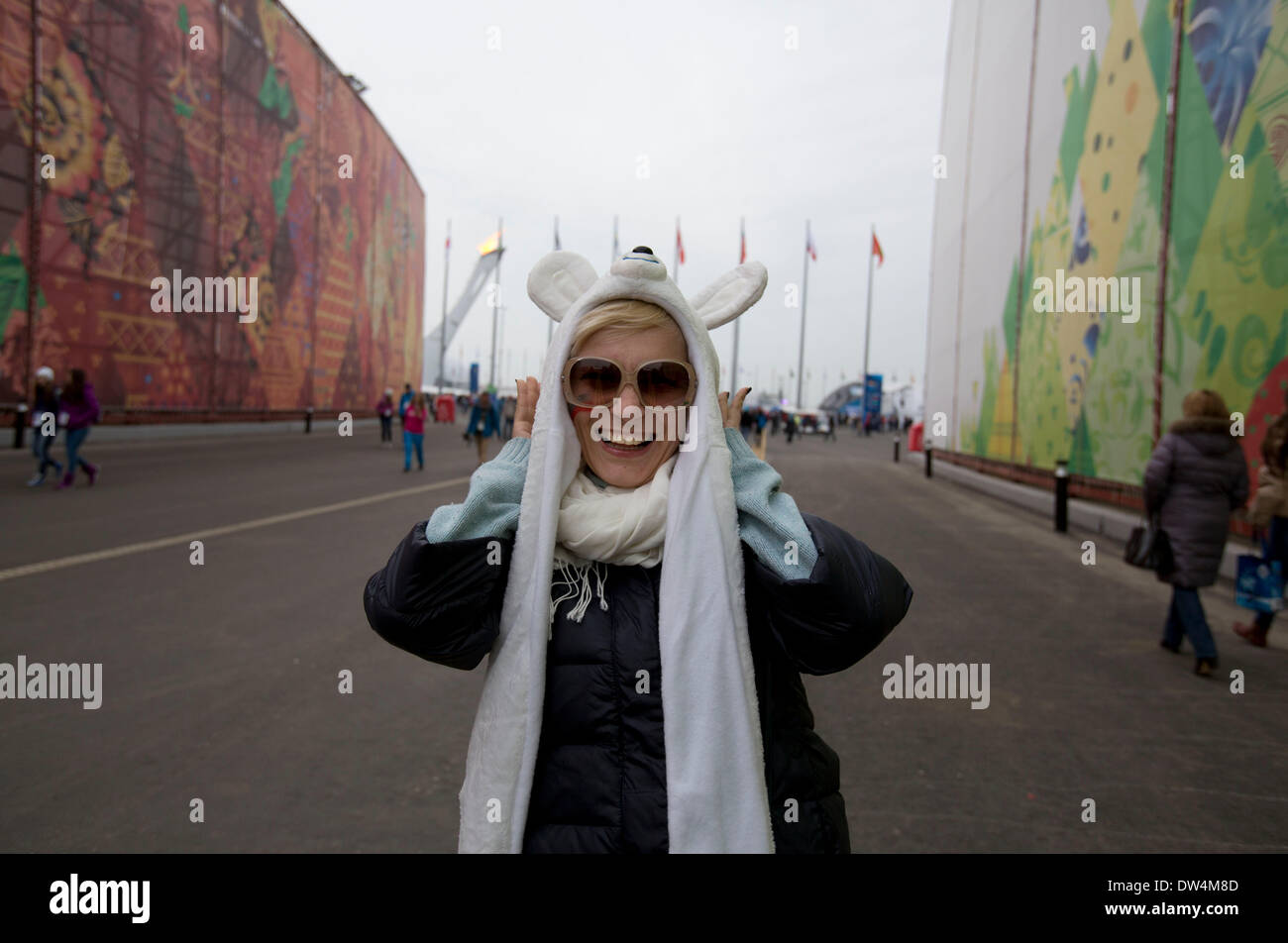 Sochi, Russia. 22nd Feb, 2014. Spectator wear the Hare mascot hat and ...