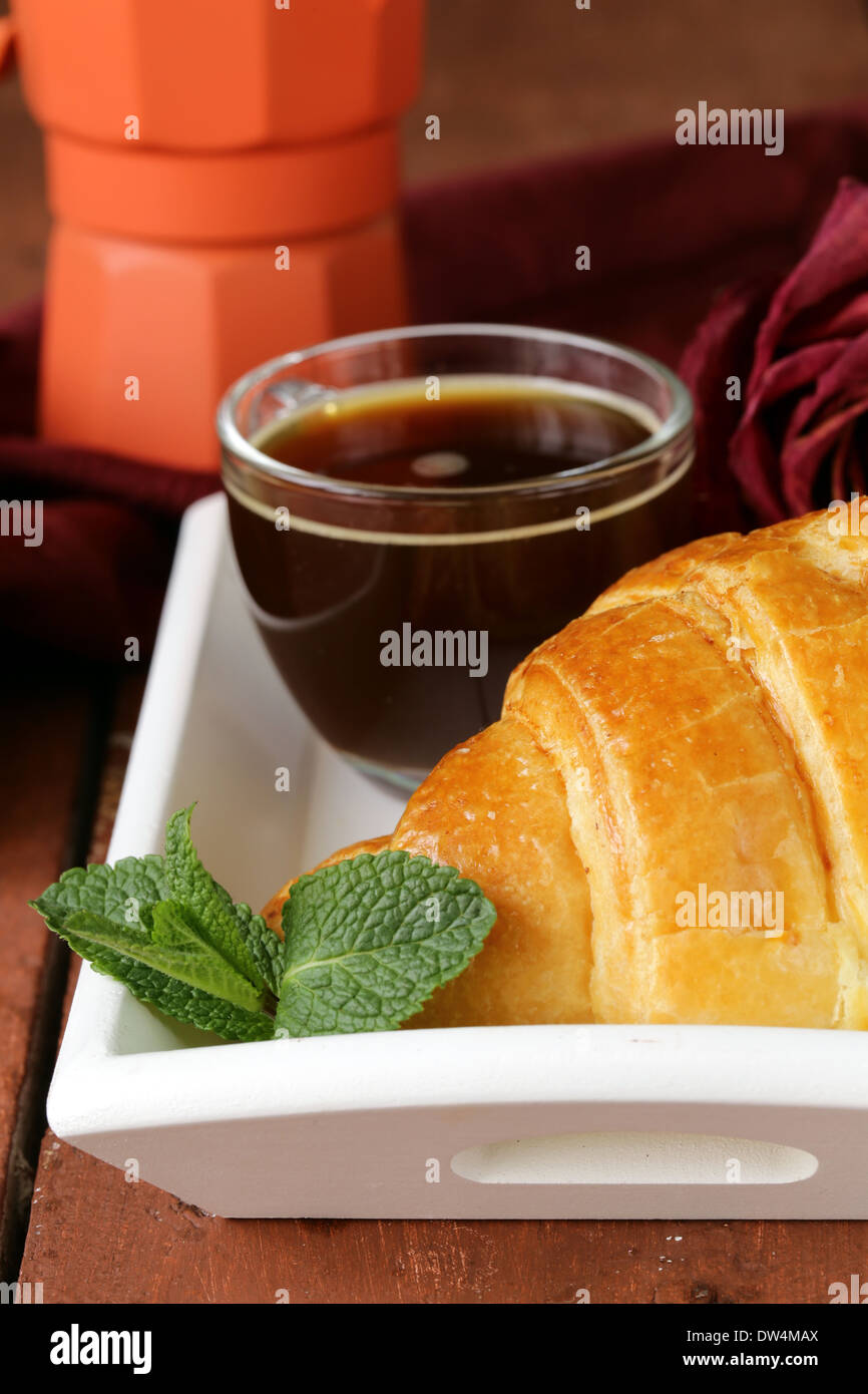 elegant coffee break or breakfast cup of coffee and croissant Stock ...