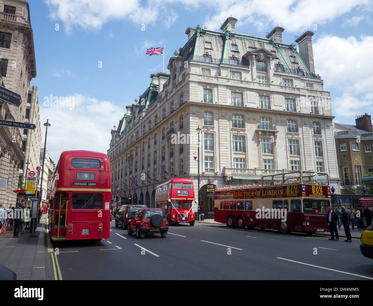 London buses and a tourist sightseeing bus outside the Ritz Hotel on ...