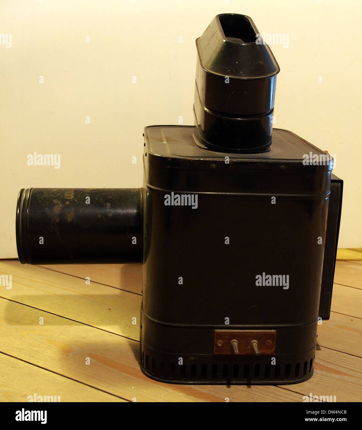 This image features an old magic lantern, an early form of image ...