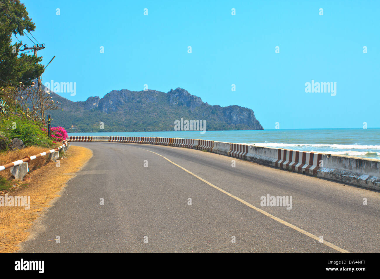 A curve road is leading to the beach Stock Photo - Alamy
