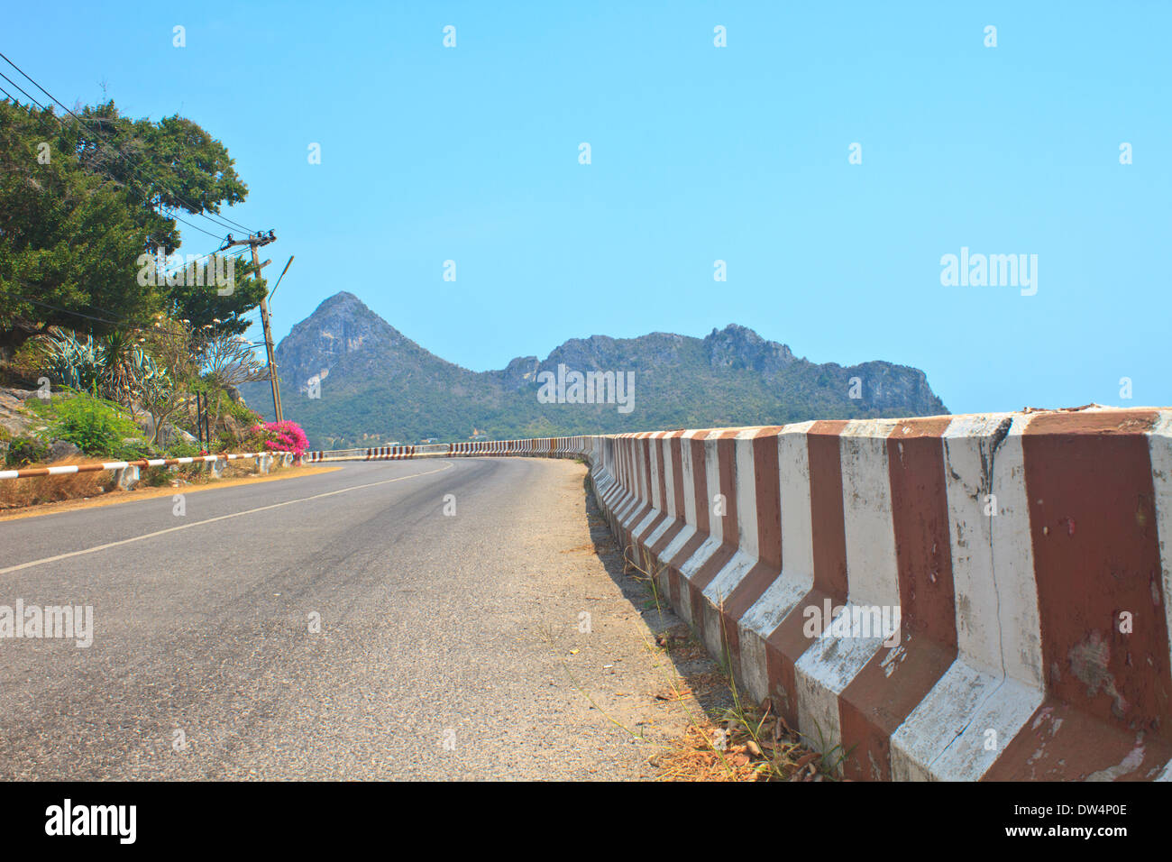 A curve road is leading to the beach Stock Photo - Alamy