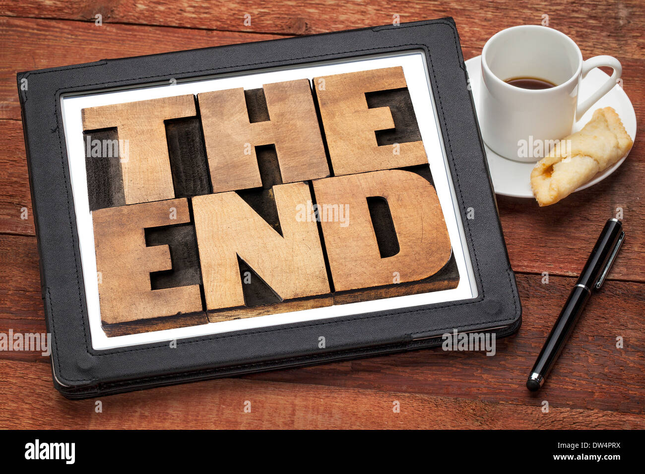 the end - text in vintage letterpress wood type on a digital tablet ...